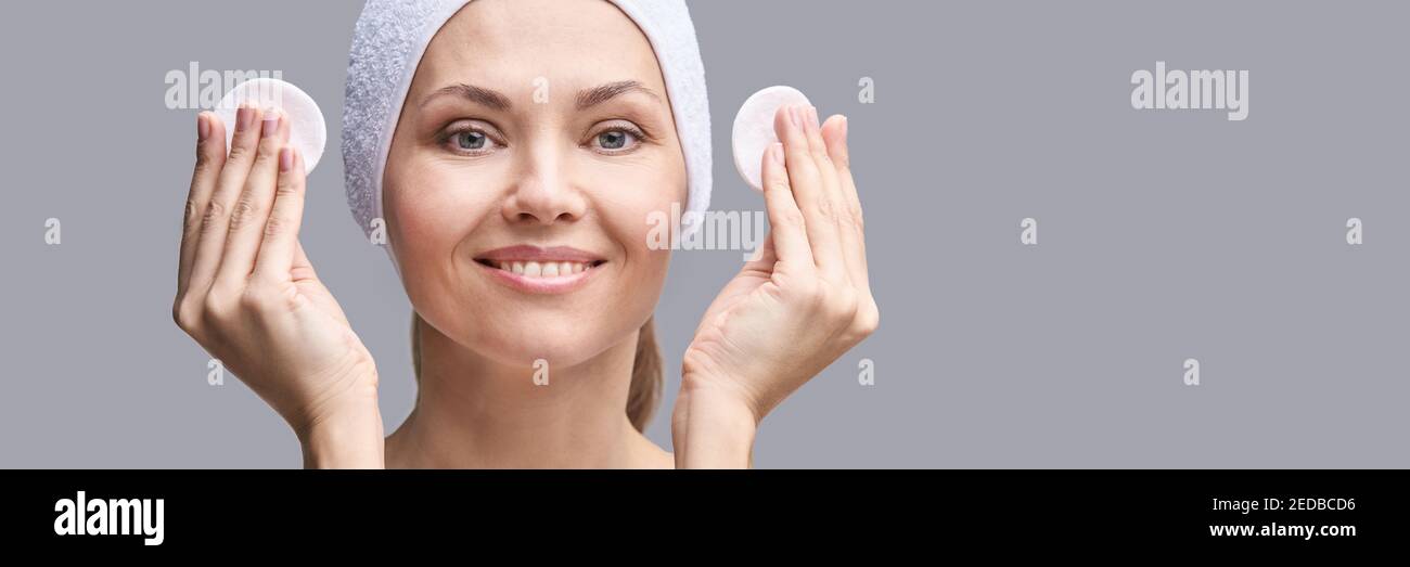 Cosmetology face cleaning. Female portrait. White cotton pad Stock ...