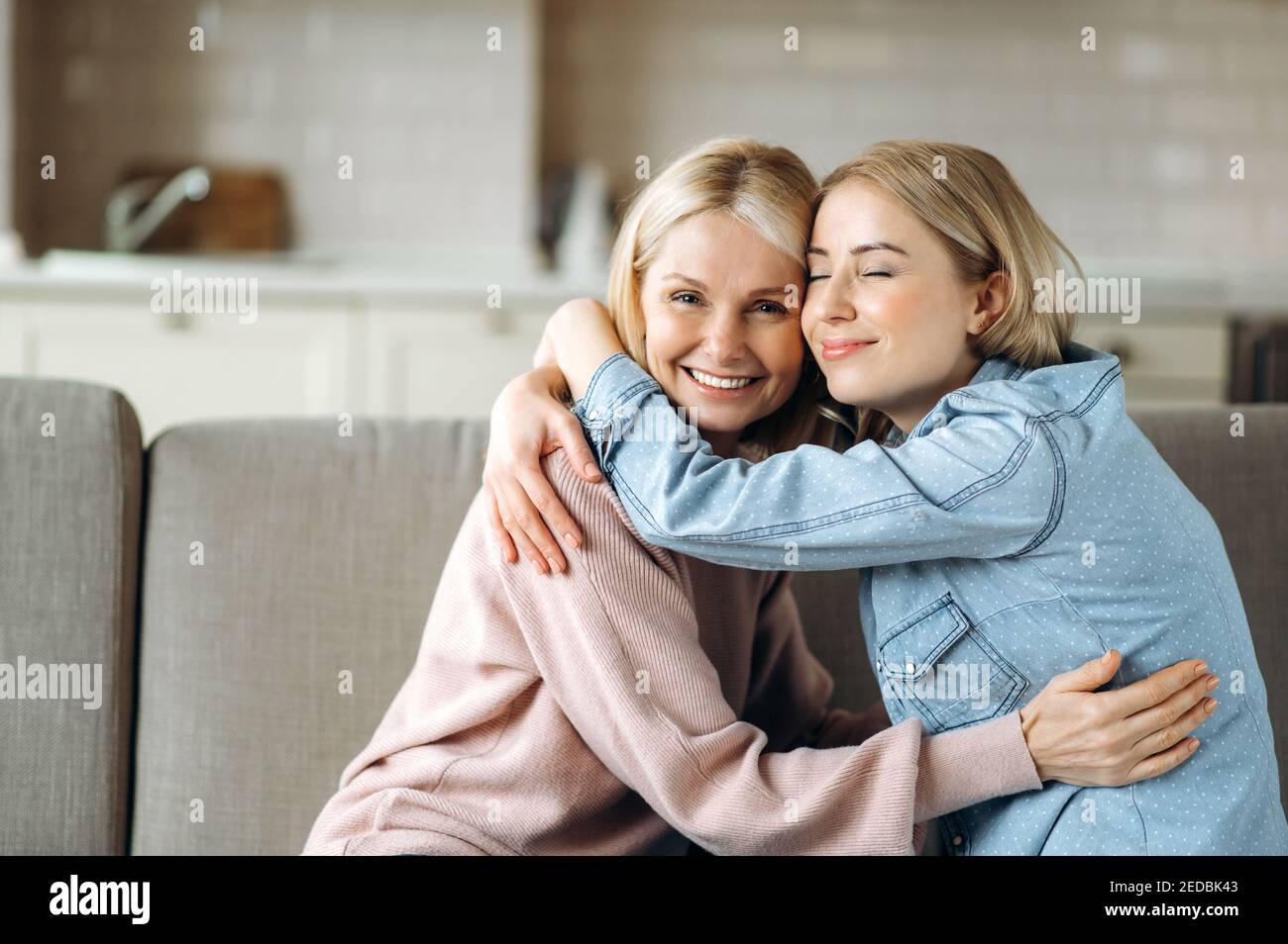 Middle Aged Blonde Caucasian Mother And Her Young Adult Happy Daughter