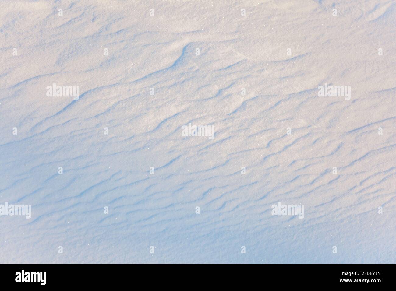 Close-up of snow wave patterns caused by wind, horizontal Stock Photo ...