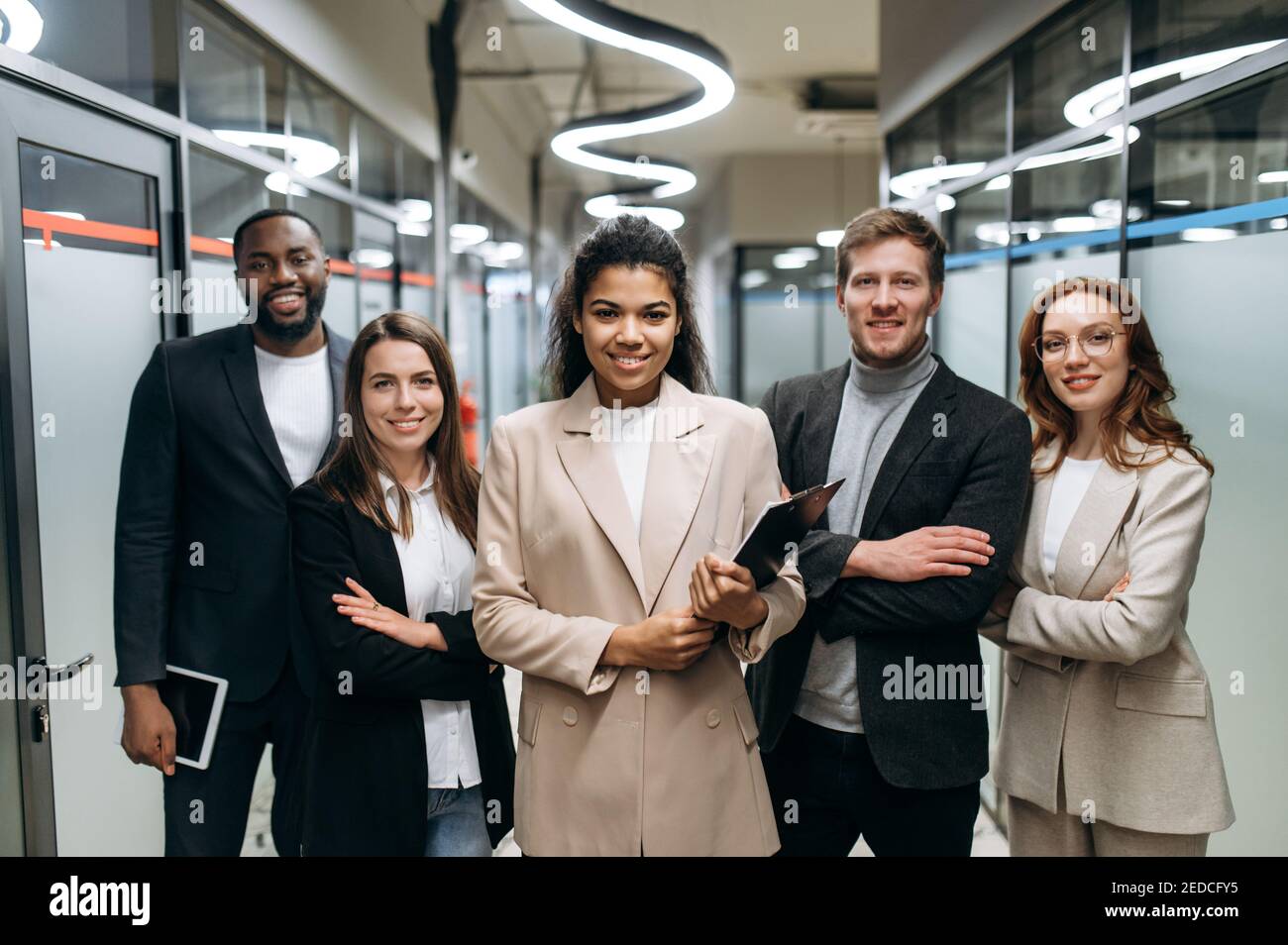 Portrait of successful influential business team in formal wear ...