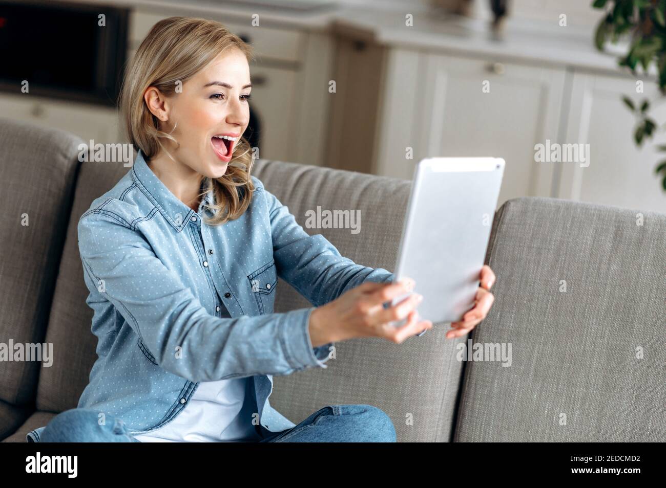 Happy female takes a selfie and smiling. Online video conference ...