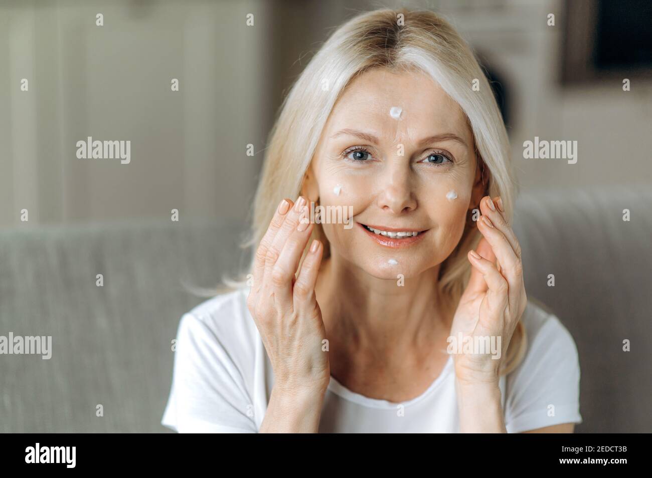 Female lady face face cream hi-res stock photography and images - Alamy