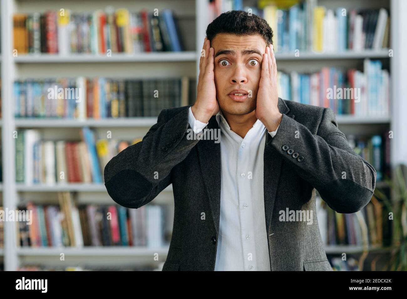 Emotional portrait of attractive hispanic man. Confused guy surprised ...