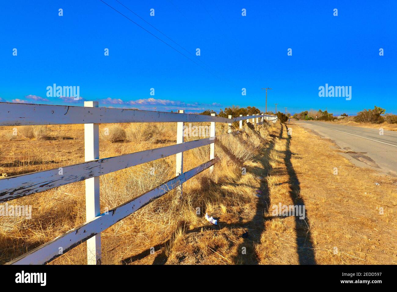 Rustic fence with rural desert landscape Stock Photo - Alamy