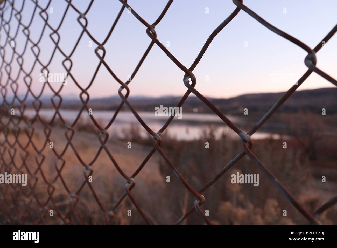 Rustic fence with rural desert landscape Stock Photo - Alamy