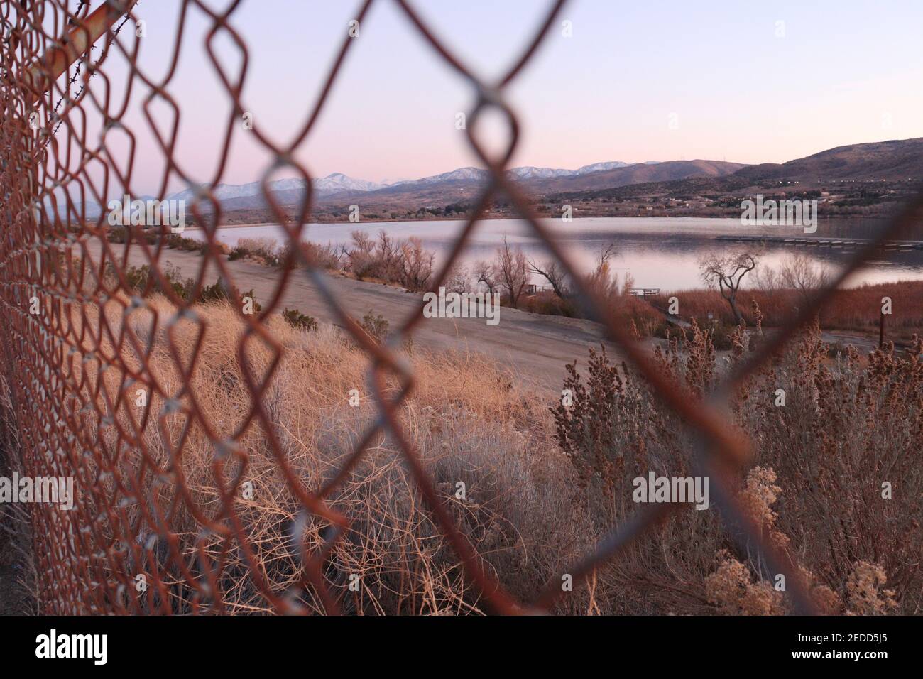 Rustic fence with rural desert landscape Stock Photo - Alamy