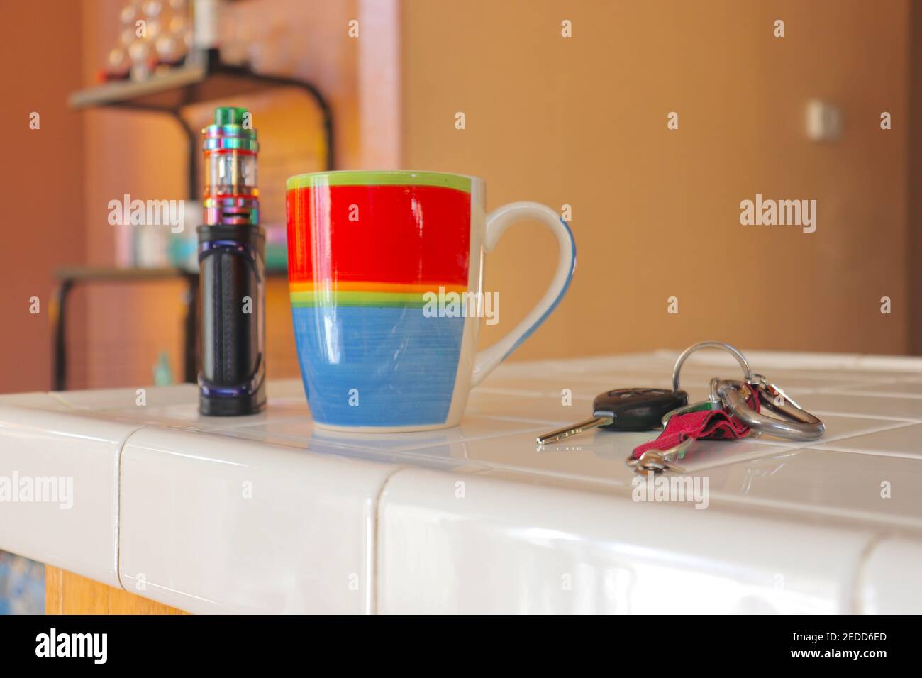 Coffee Cup, Vape, and Cars keys Laying on Kitchen Counter in The ...