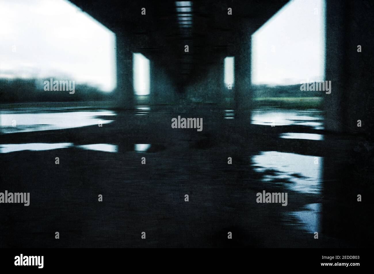 A moody dream like concept. Under a road bridge in a post industrial ...
