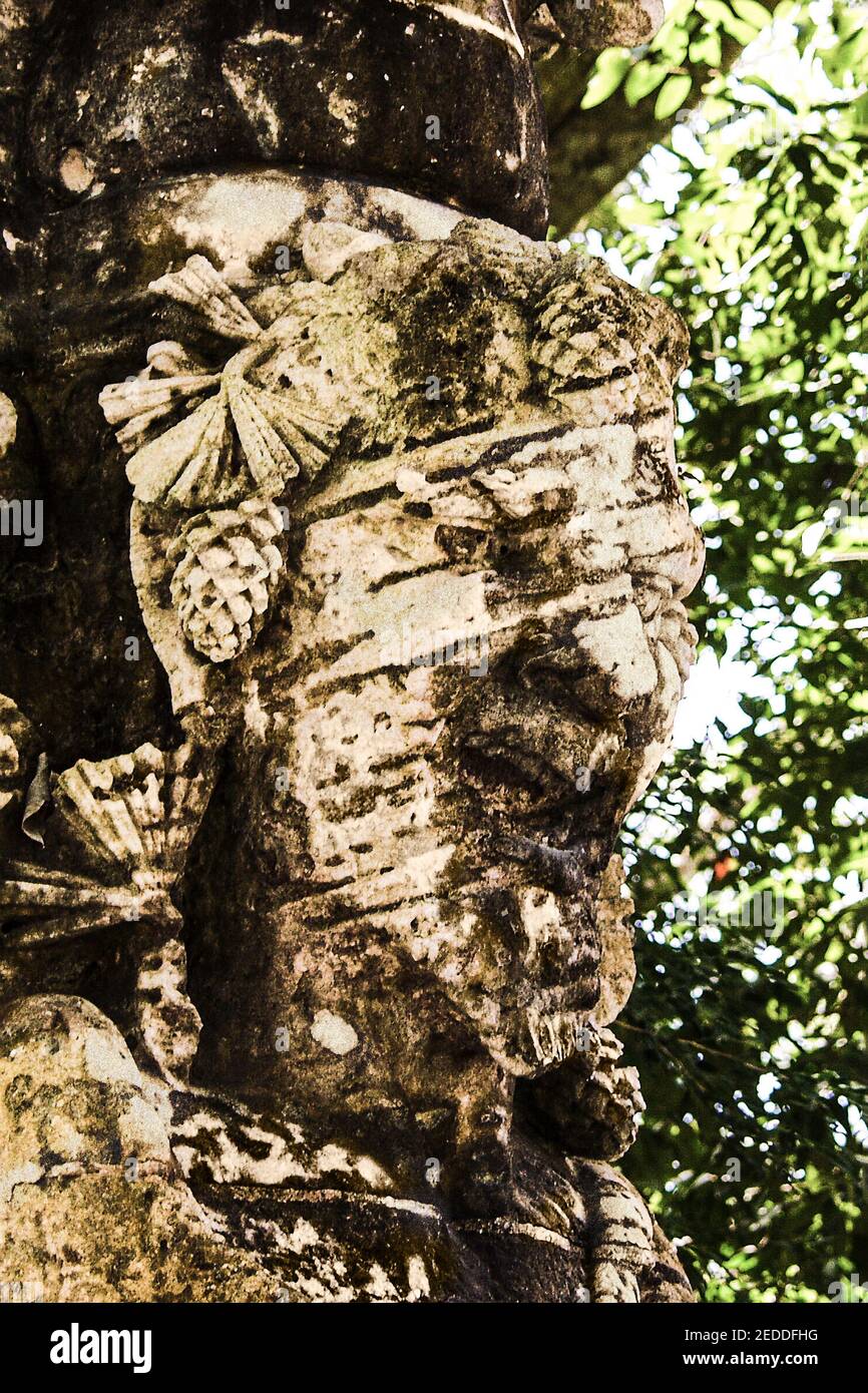 Carved stone Roman Satyr face on the Garden Mound of Villa Vizcaya in ...