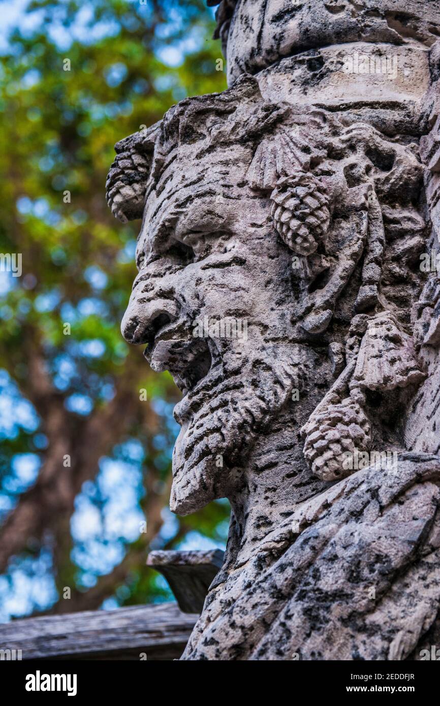 Carved stone Roman Satyr face on the Garden Mound of Villa Vizcaya in ...