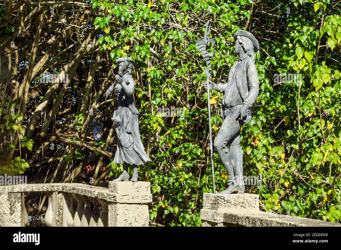 A pair of bronze statues by the entrance to the Theater Garden at Villa ...