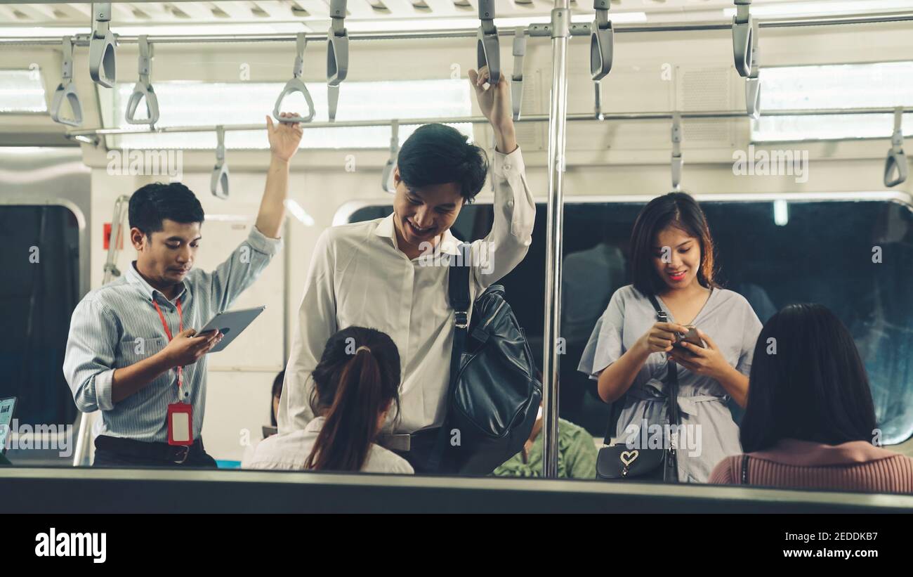 Many people crowded into a full subway hi-res stock photography and ...