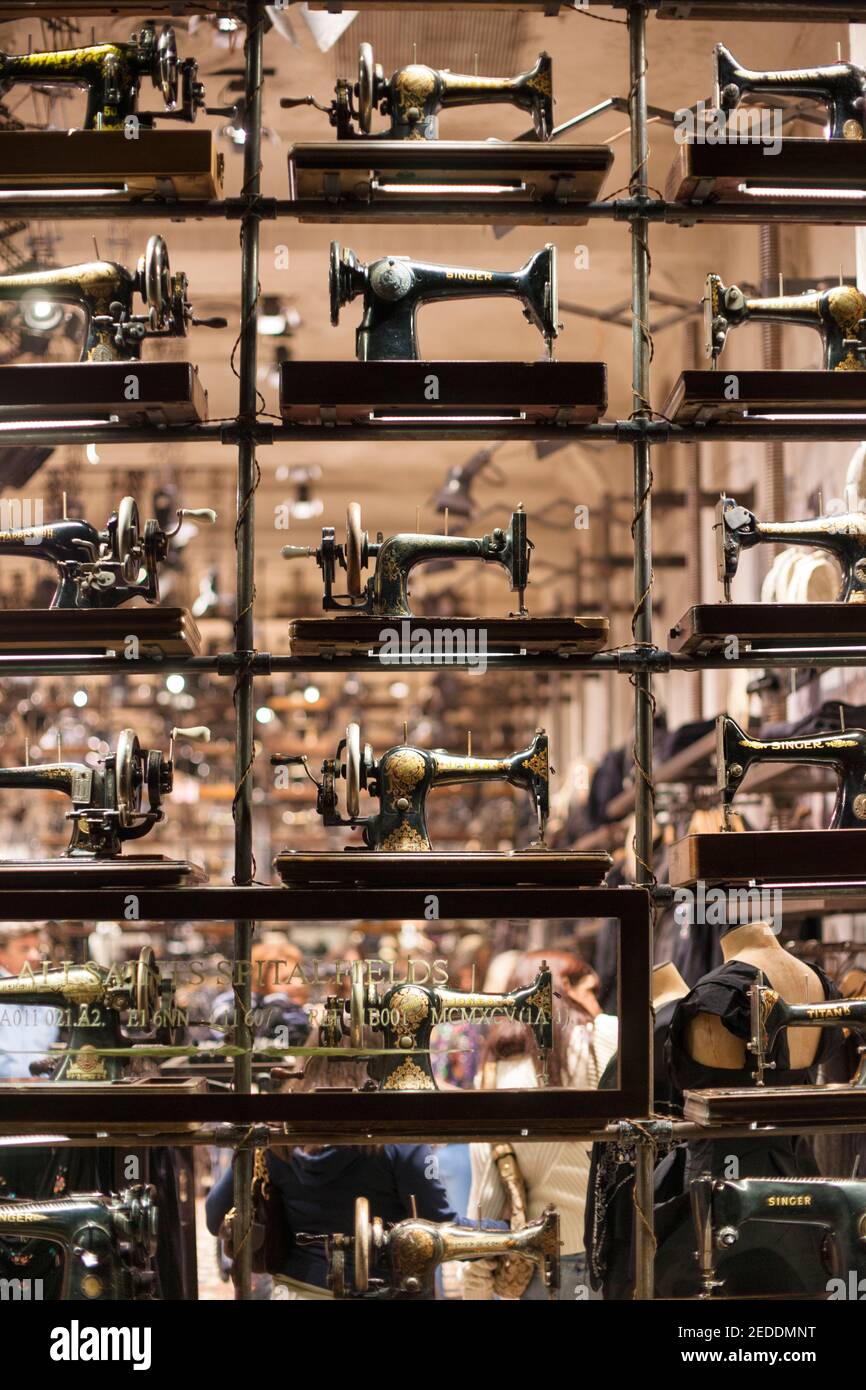 Window display with vintage sewing machines at the AllSaints ...