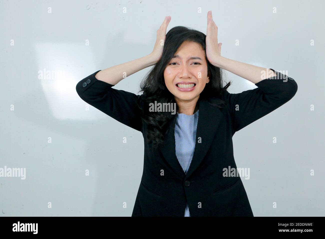 Business young asian girl is stress and confuse about her work isolated ...