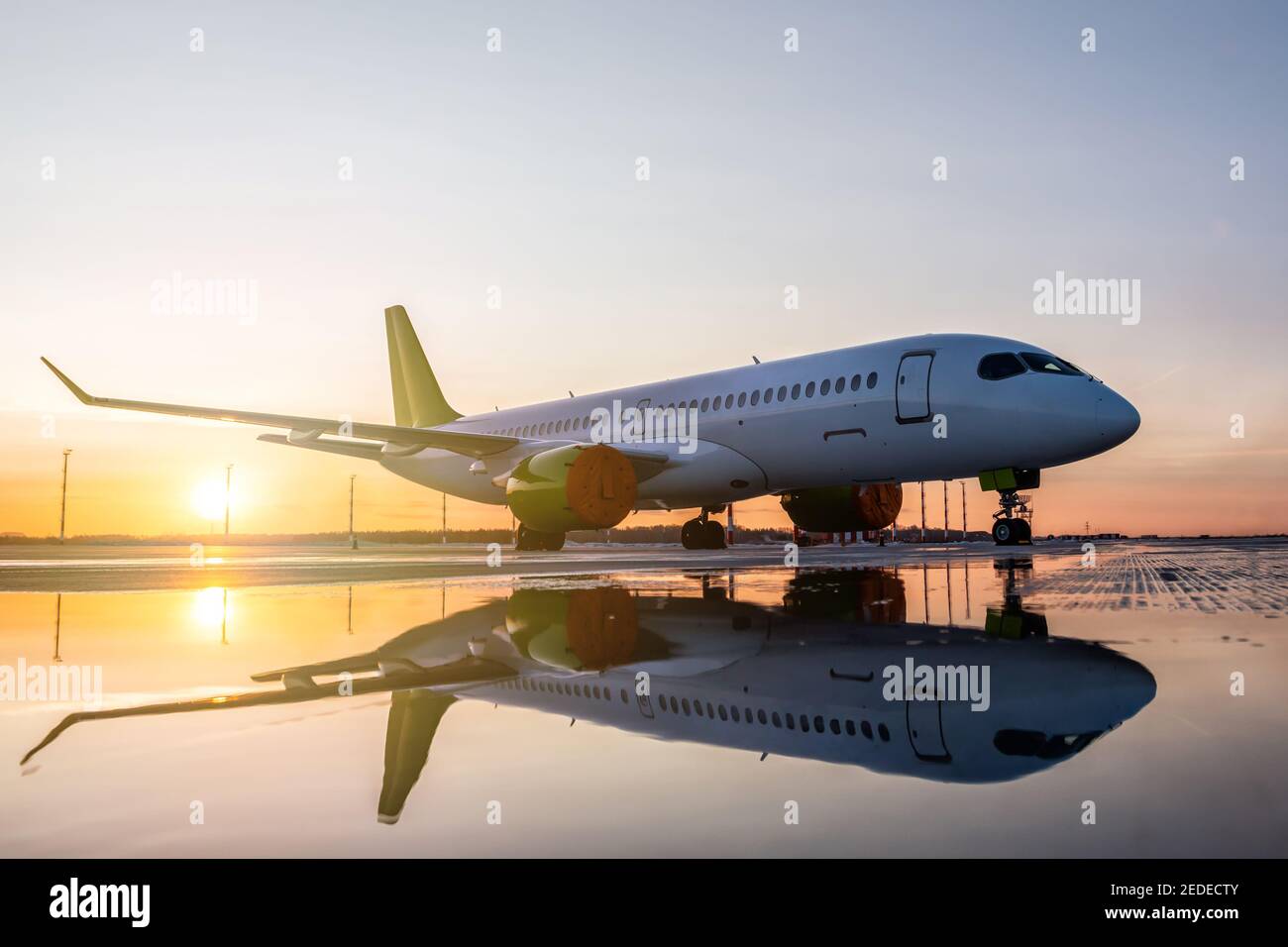 Modern passenger airplane on the apron of the airport against the ...