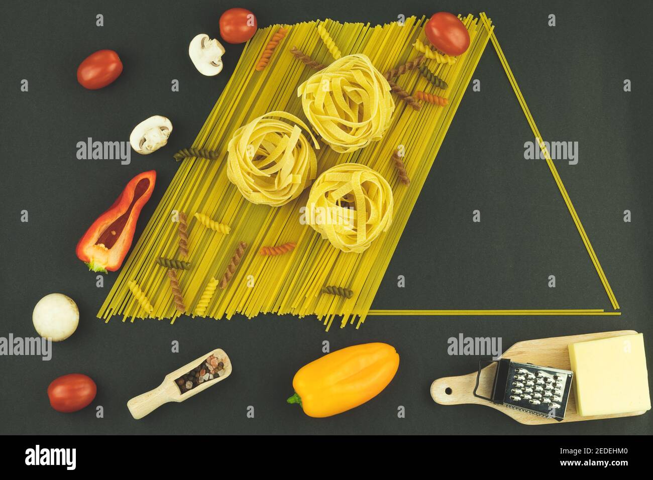 Background Layout for cooking, pasta and vegetables, spread out on the ...
