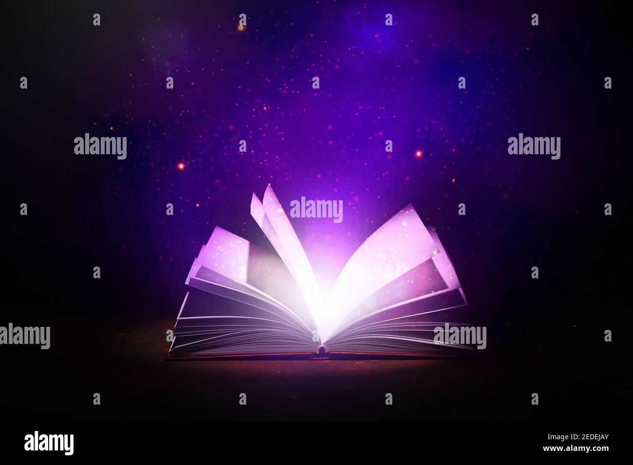 Open magic book on dark background Stock Photo - Alamy