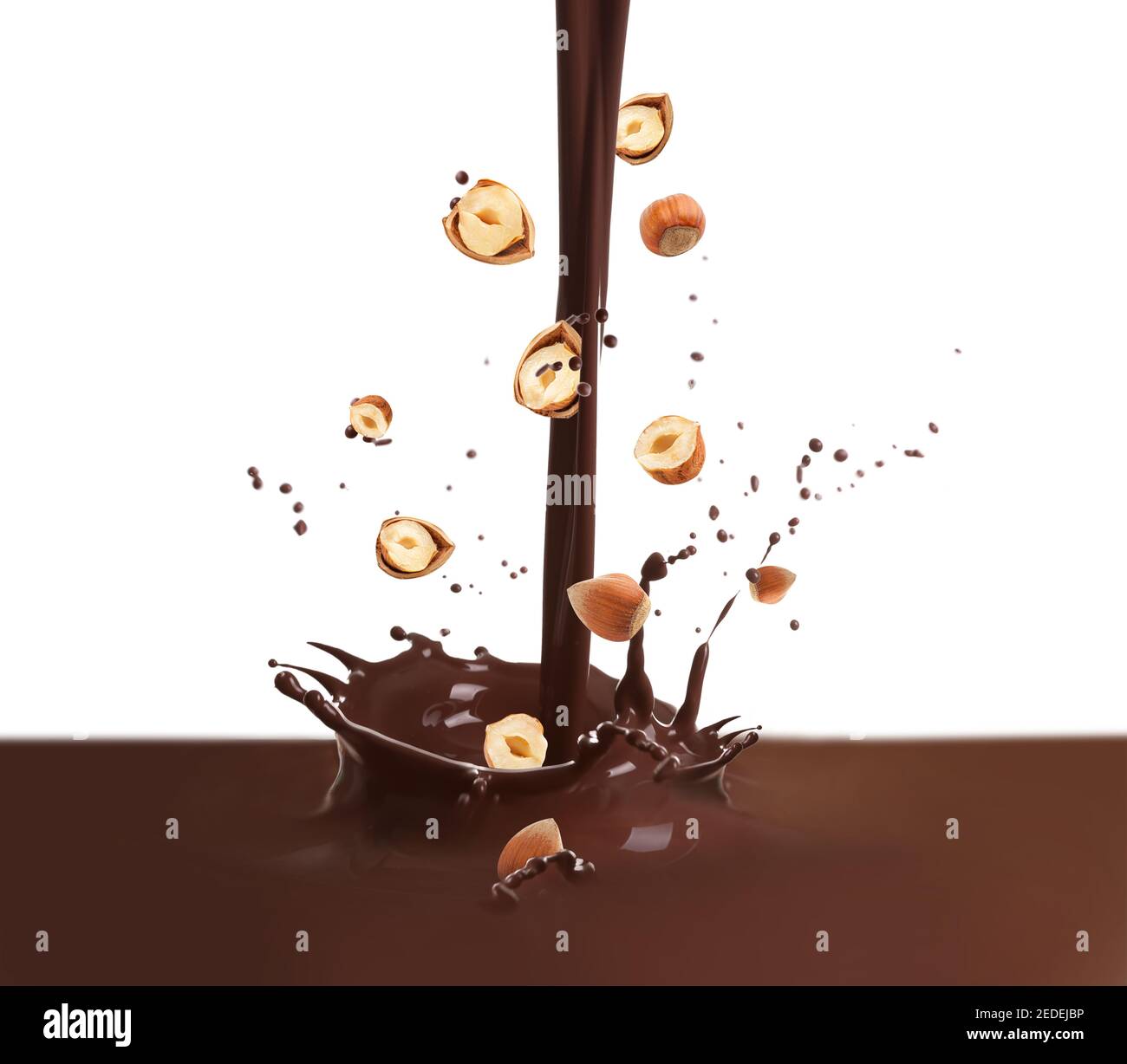 Splash of hot chocolate and hazelnuts on white background Stock Photo ...