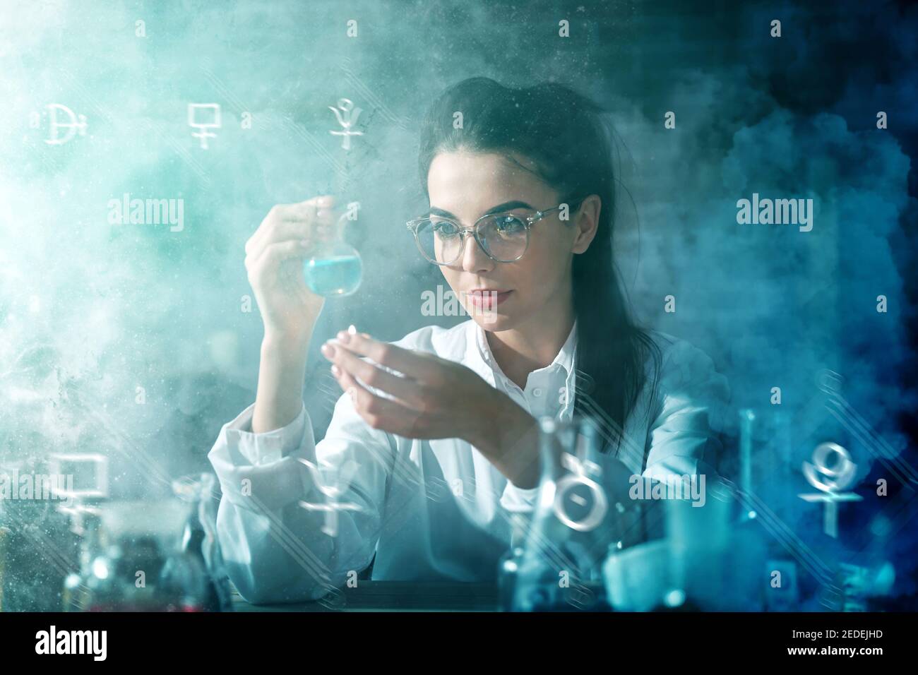 Female alchemist working in laboratory Stock Photo - Alamy