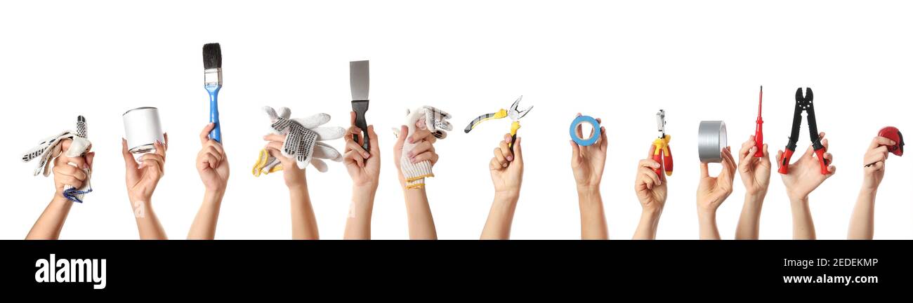 Female hands with different construction tools on white background ...