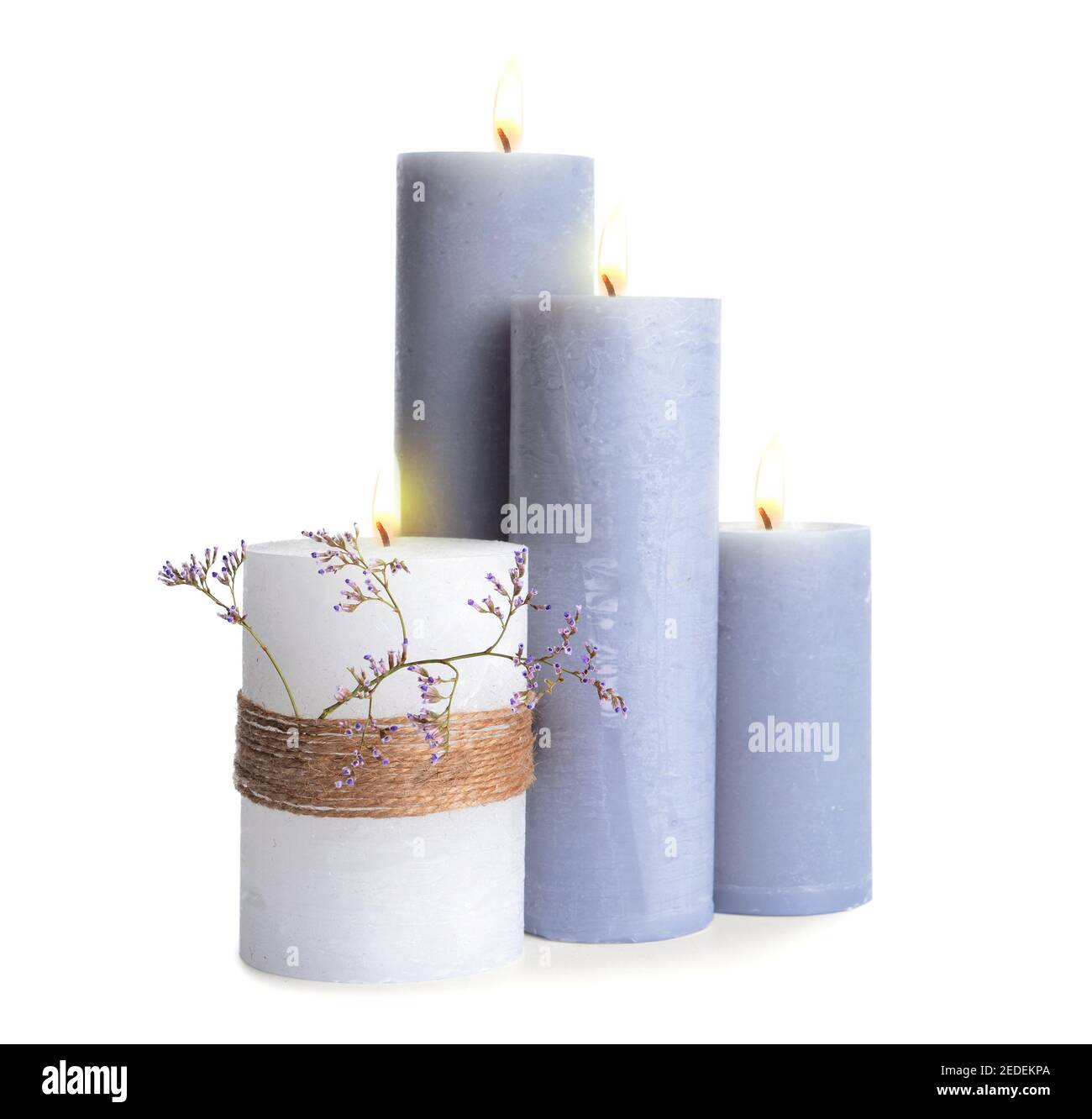 Glowing wax candles on white background Stock Photo - Alamy