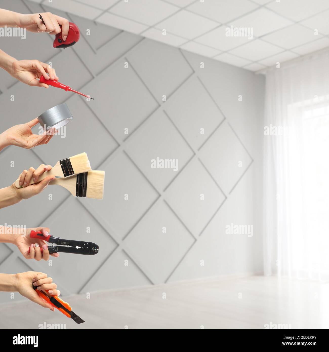 Many hands with different construction tools indoors Stock Photo - Alamy