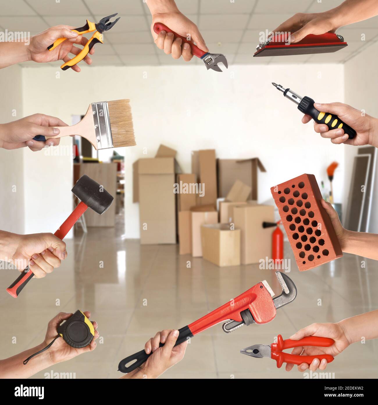 Many hands with different construction tools indoors Stock Photo - Alamy
