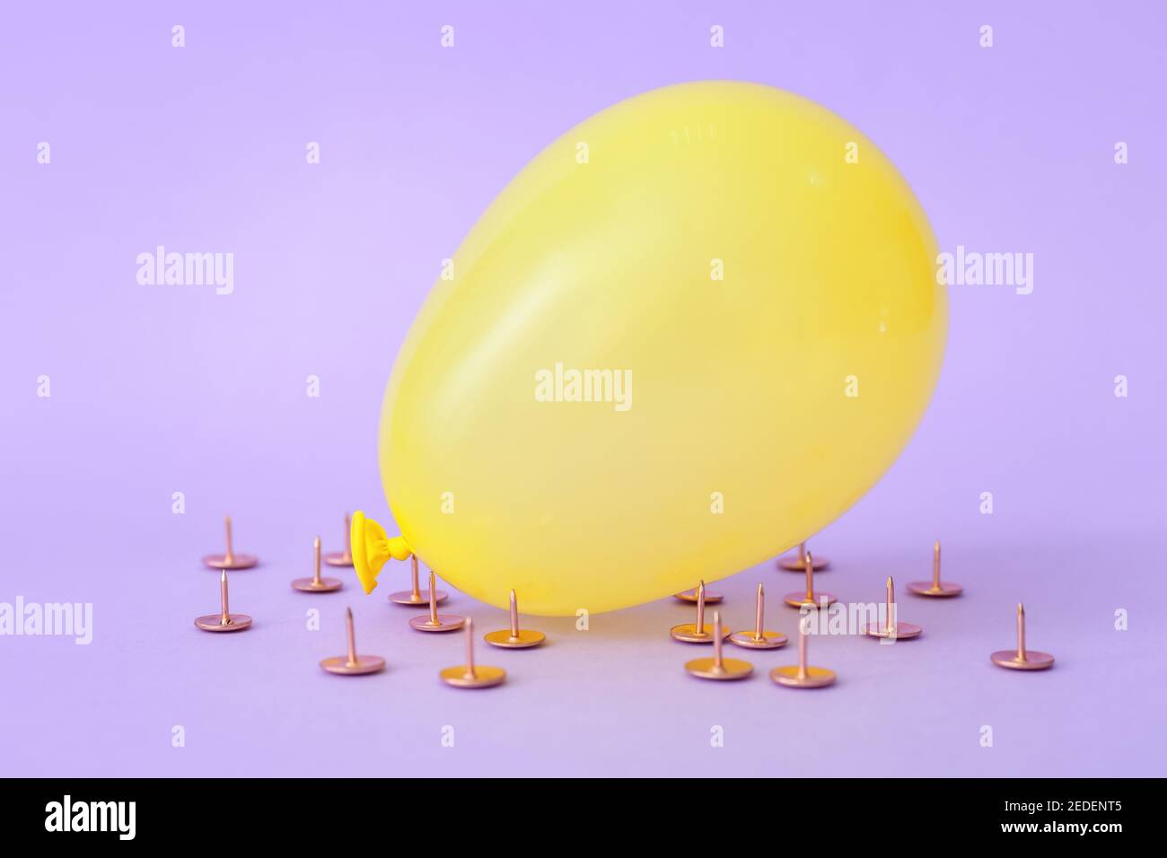 Office pins and air balloon on color background Stock Photo - Alamy