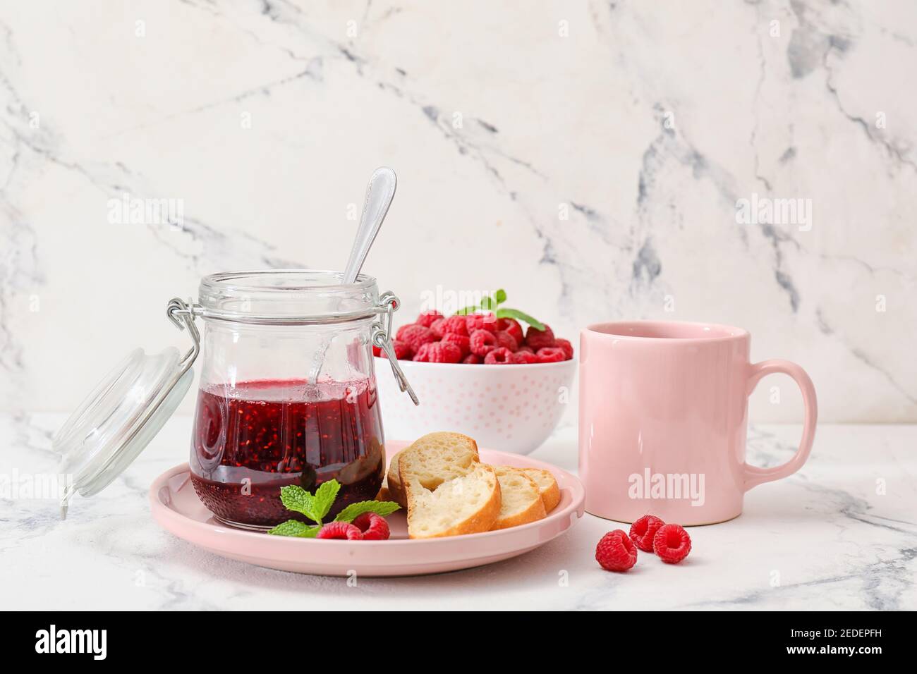 Composition with sweet raspberry jam on light background Stock Photo ...