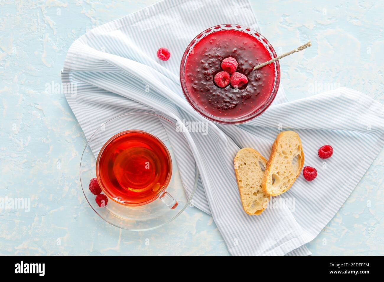 Composition with sweet raspberry jam on light background Stock Photo ...