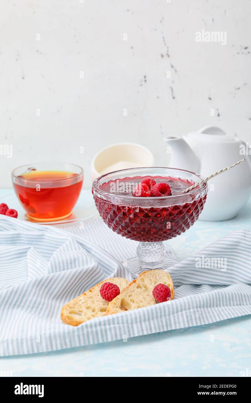 Composition with sweet raspberry jam on light background Stock Photo ...