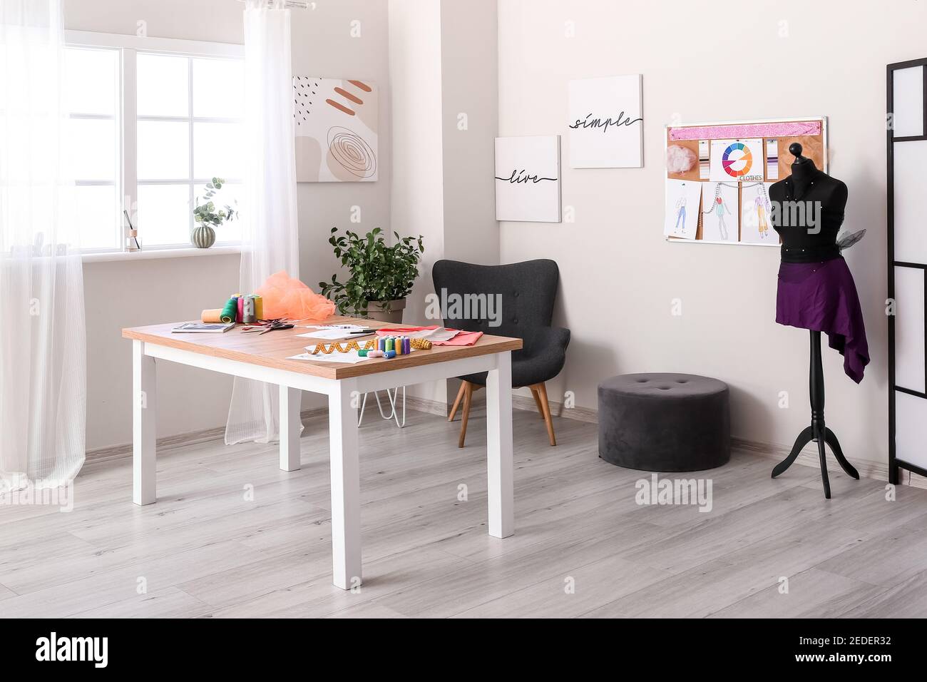 Interior of modern fashion designer workplace Stock Photo - Alamy