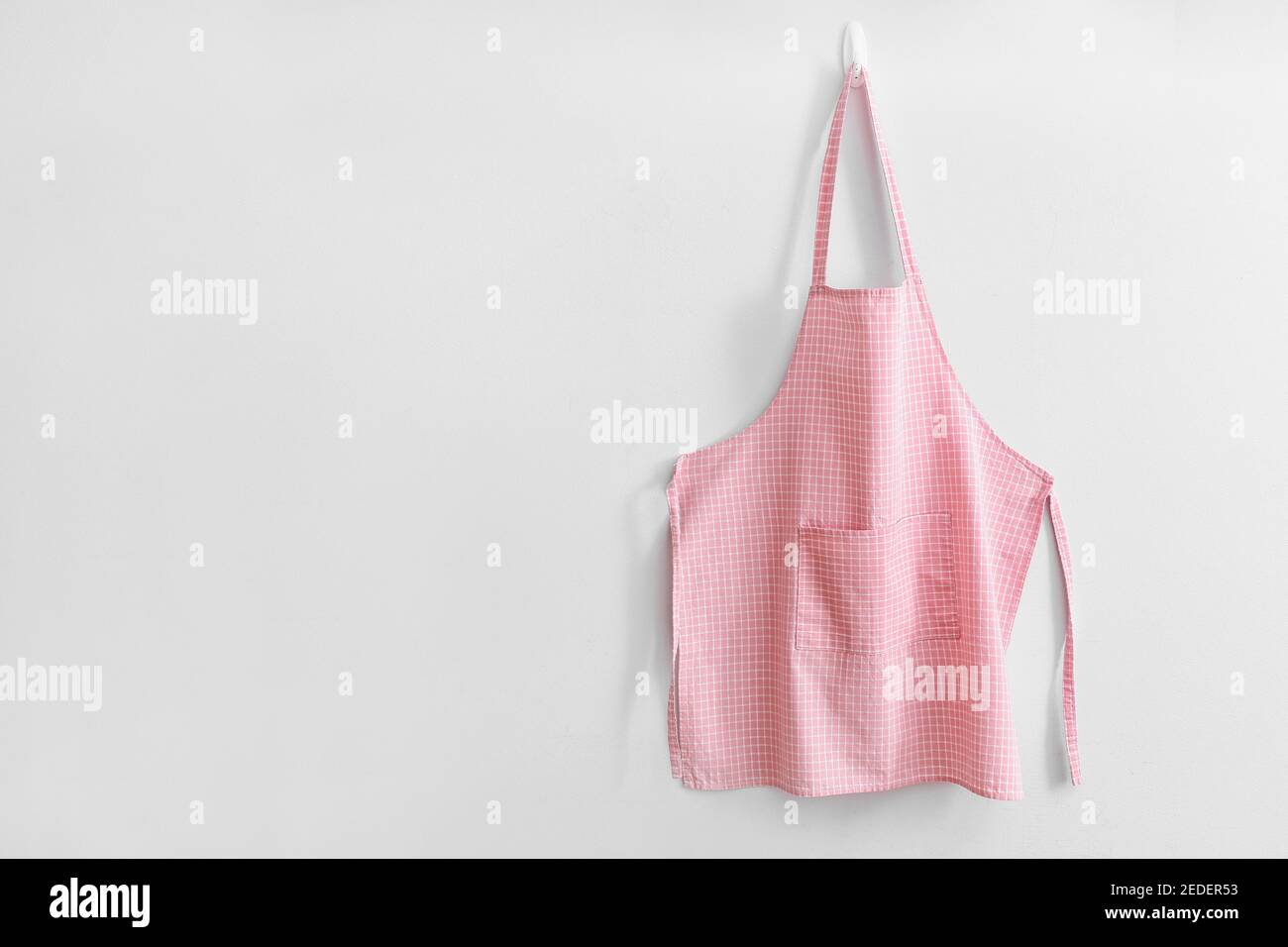 Clean apron on light background Stock Photo - Alamy