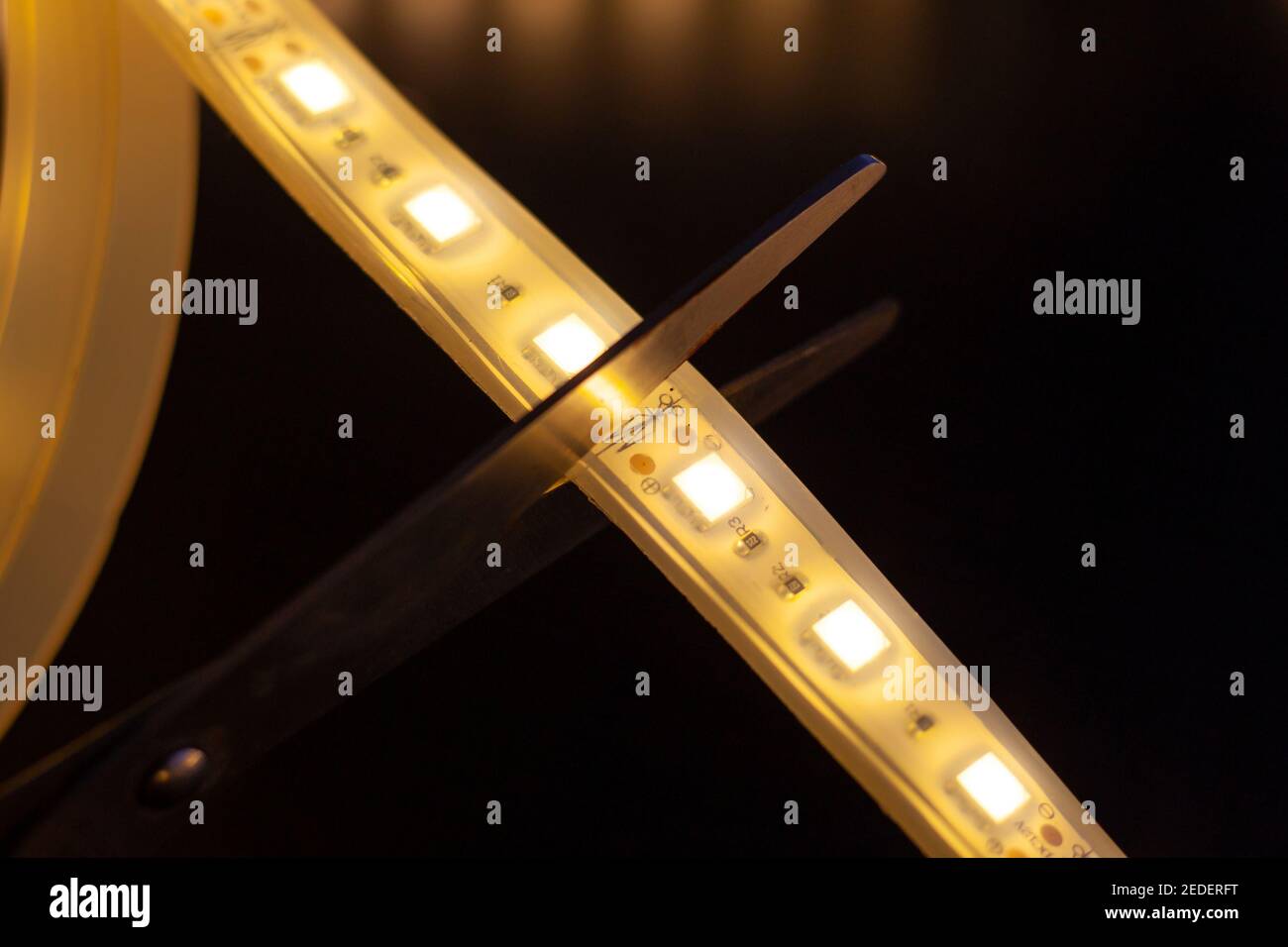 cutting off excess pieces of LED strip Stock Photo - Alamy