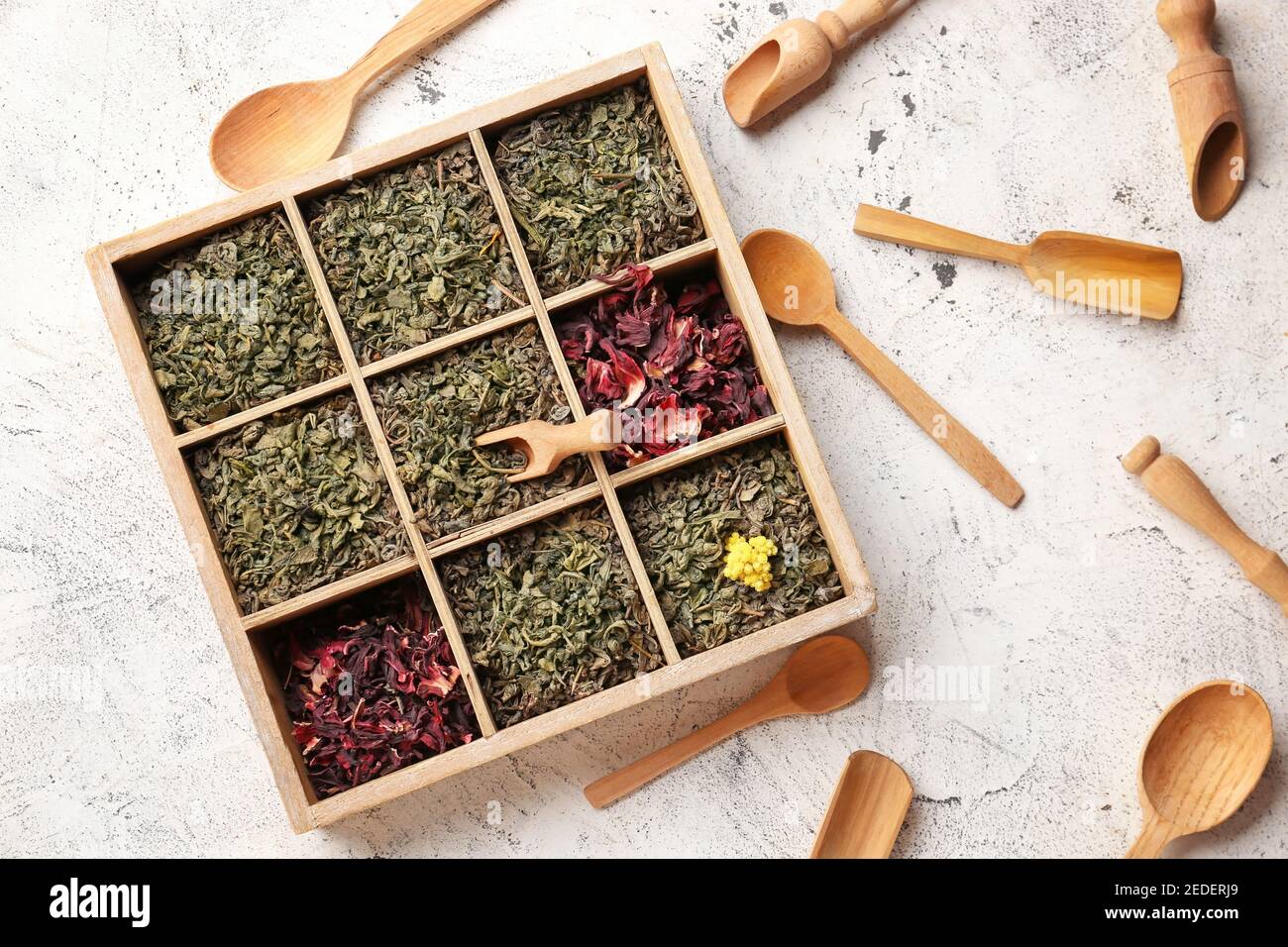 Box with dry green tea on light background Stock Photo - Alamy