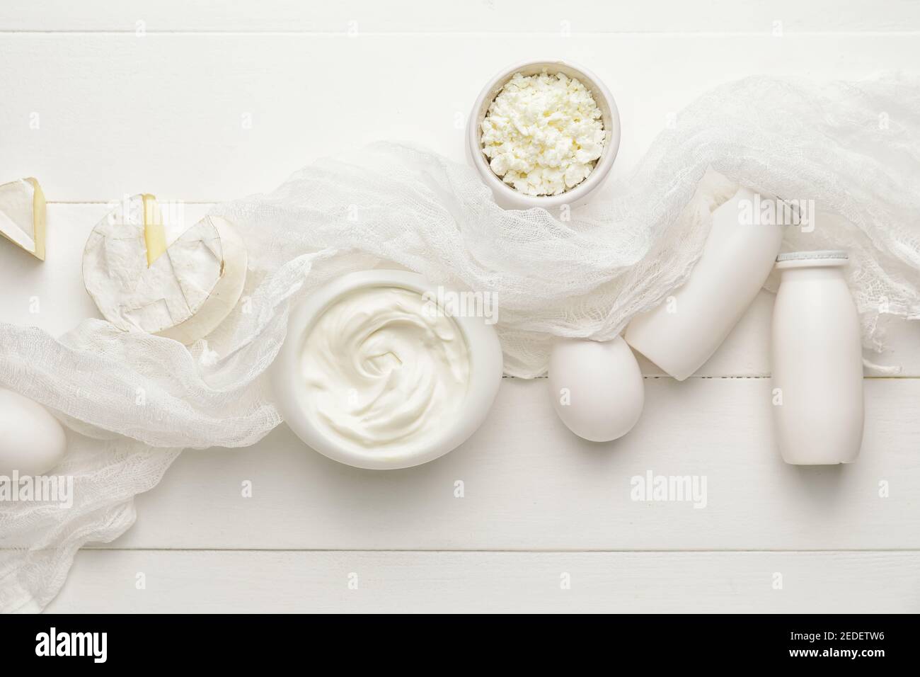 Different dairy products without lactose on light wooden background ...