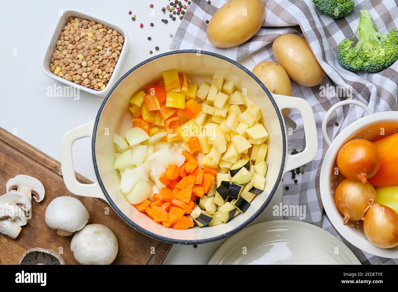 Vegetables in cooking pot on light background Stock Photo - Alamy