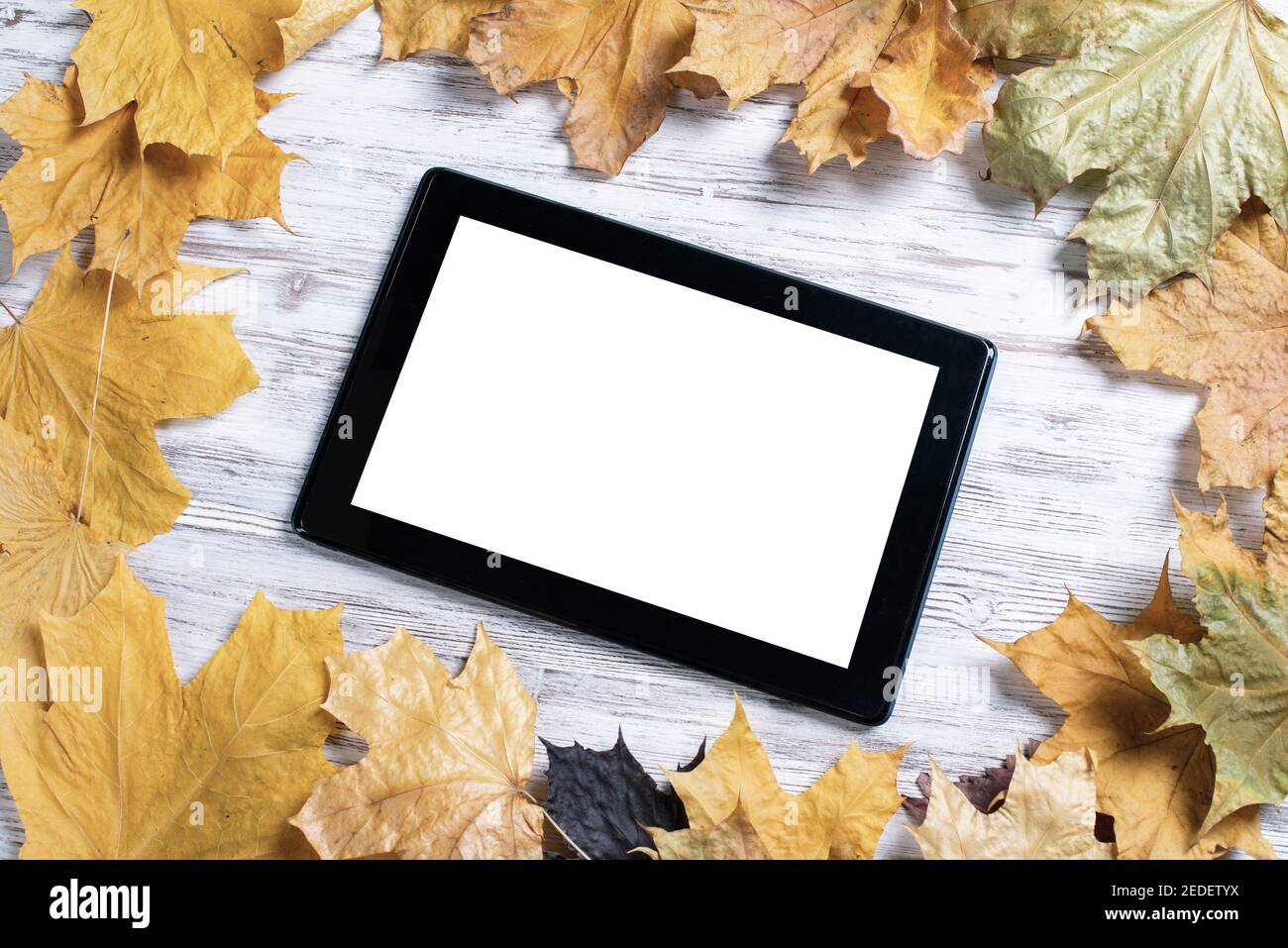 Tablet computer with blank screen on desk Stock Photo - Alamy