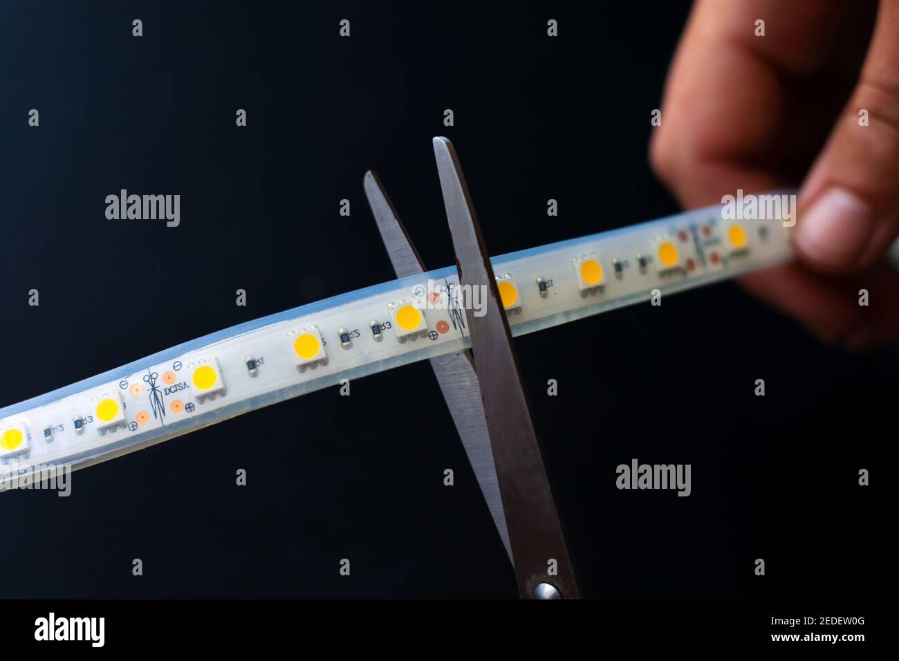 cutting led strip with scissors,installation of a diode tape Stock ...
