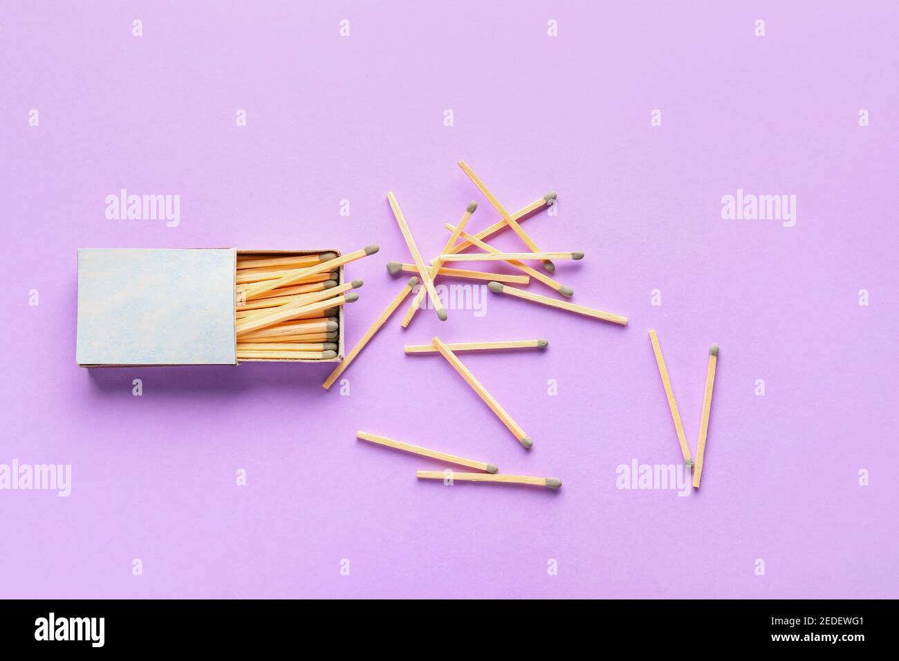 Box with matches on color background Stock Photo - Alamy