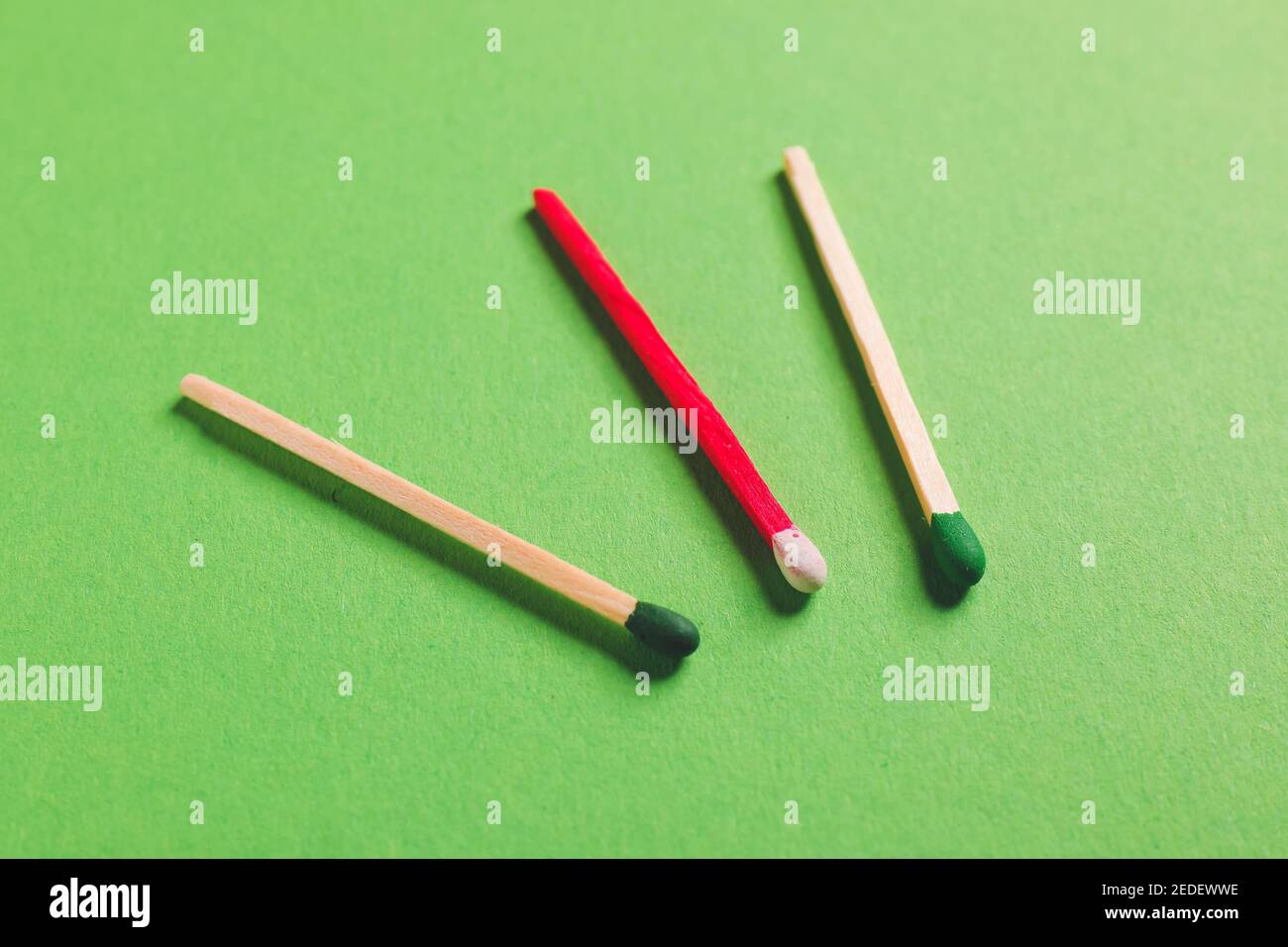 Different matches on color background Stock Photo - Alamy