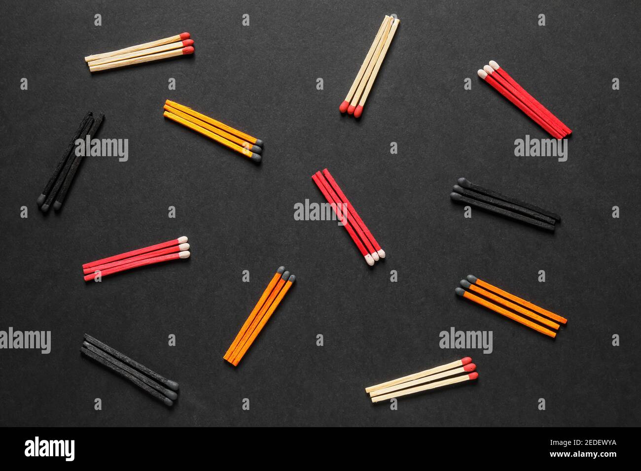 Different matches on dark background Stock Photo - Alamy