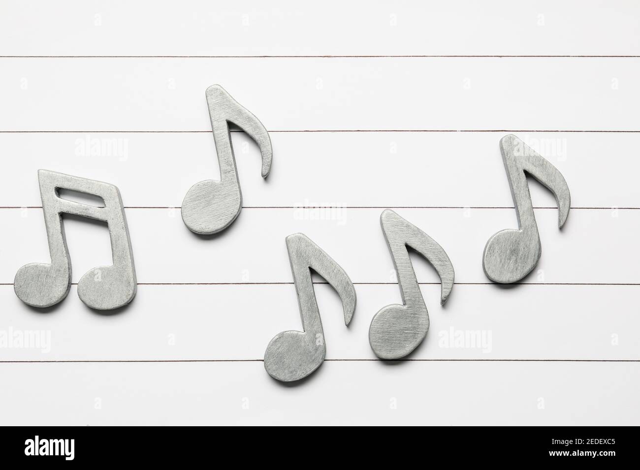 Music notes on light background Stock Photo - Alamy