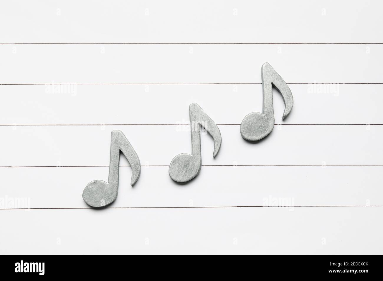 Music notes on light background Stock Photo - Alamy