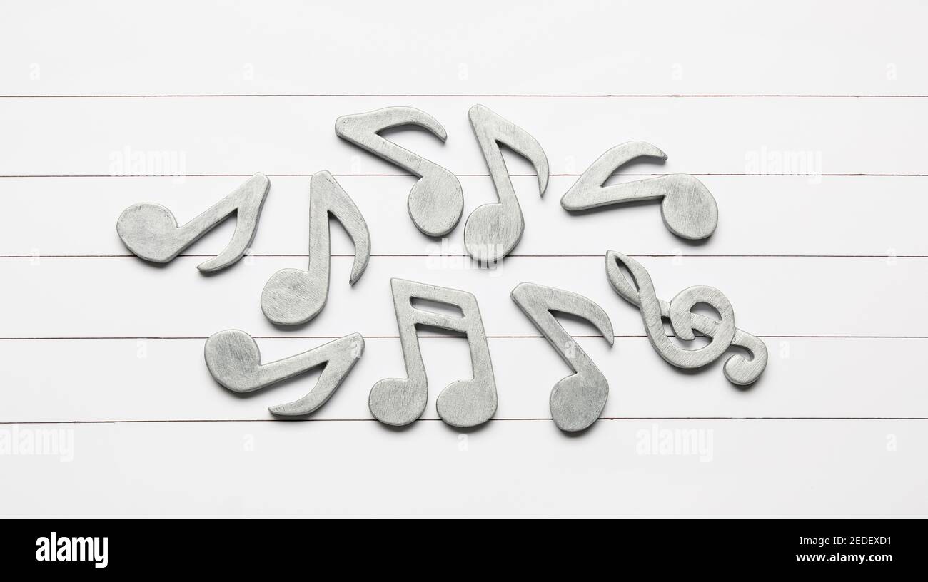 Music notes on light background Stock Photo - Alamy