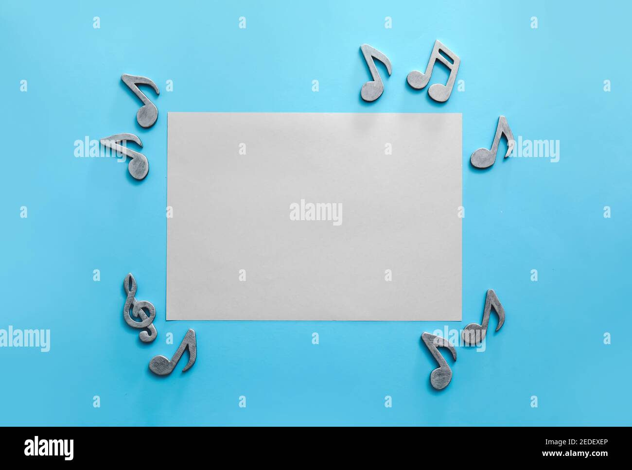 Note signs and blank sheet of paper on color background Stock Photo - Alamy