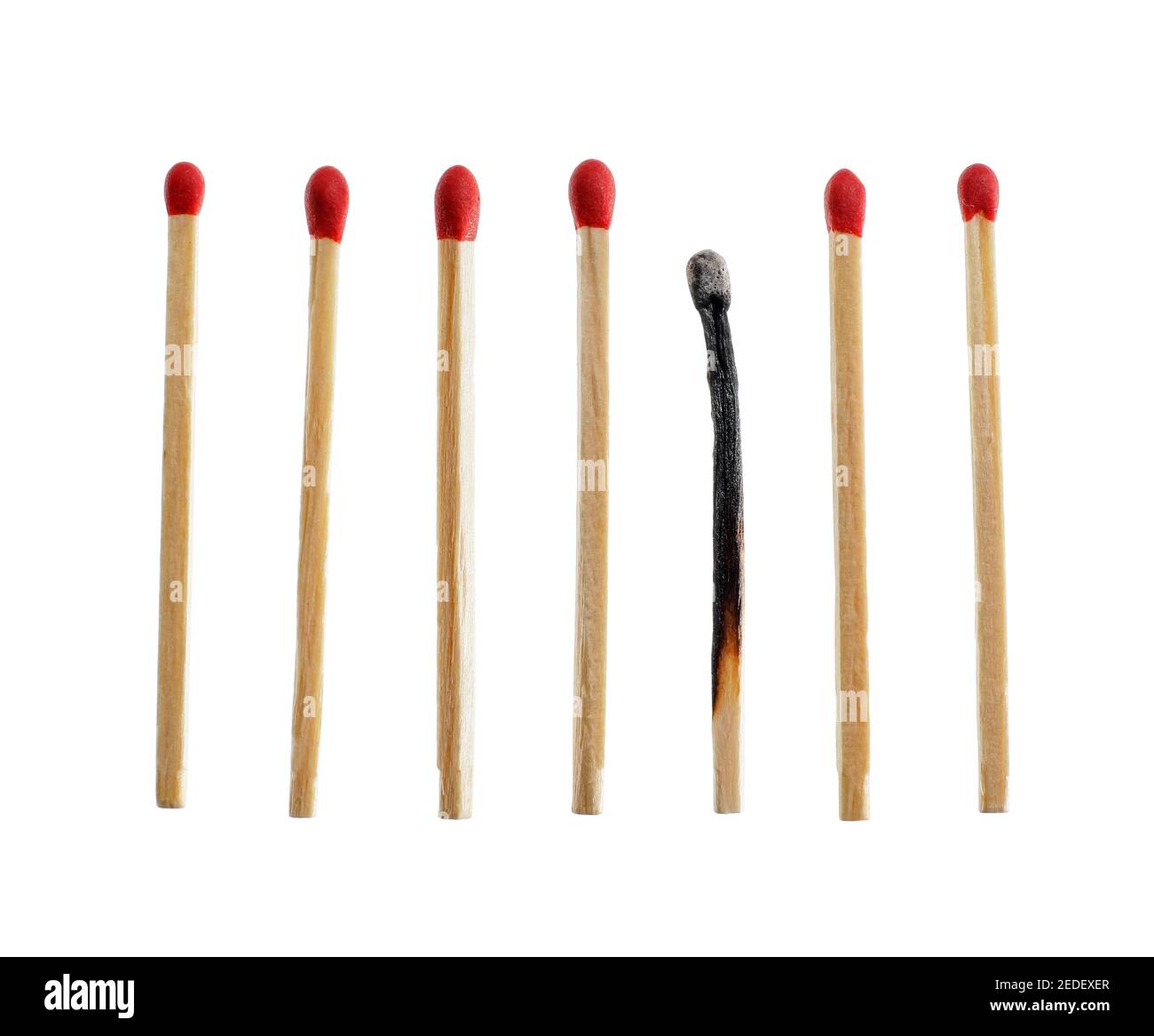 One burnt out match among whole ones on white background Stock Photo ...