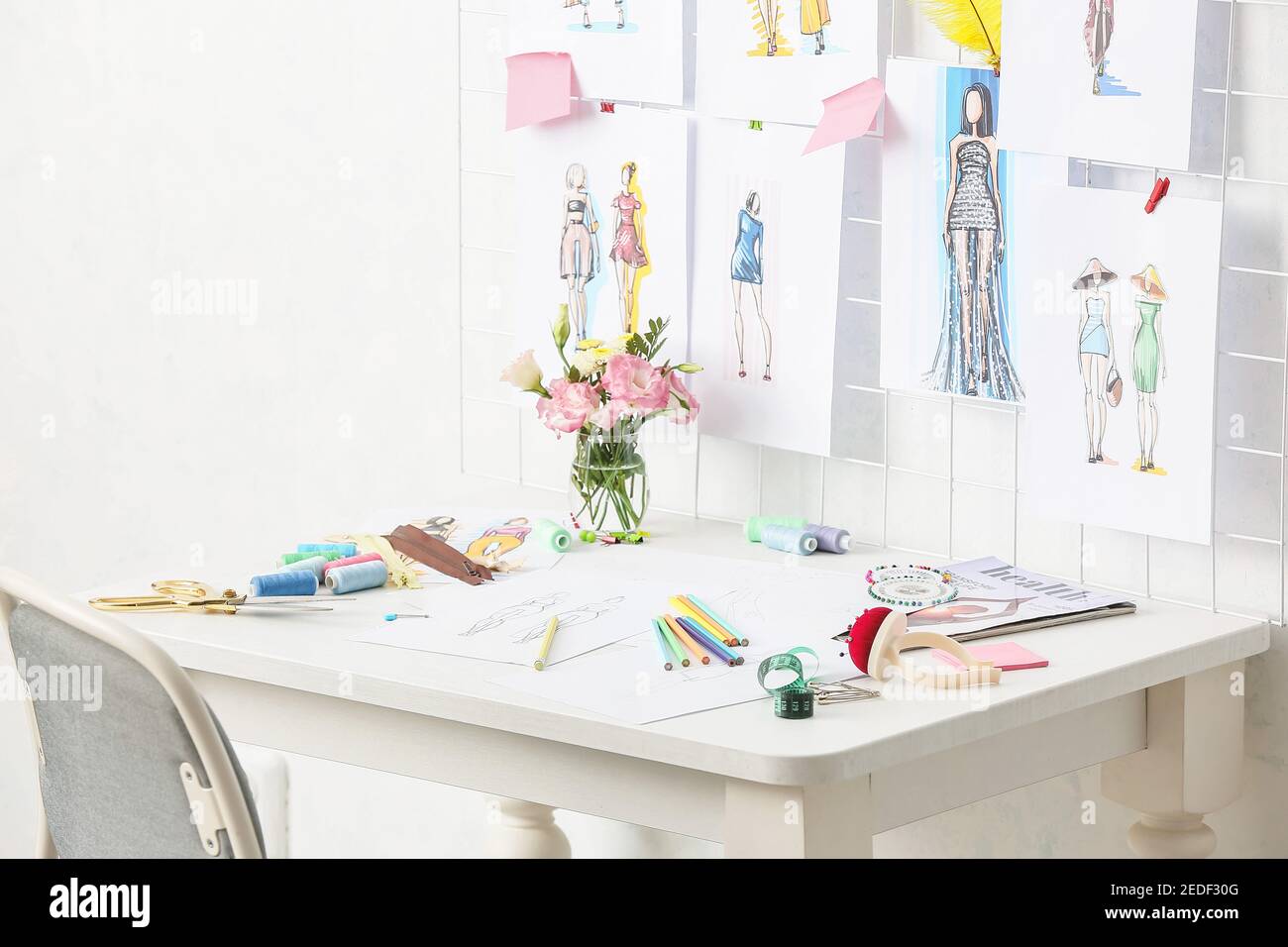 Fashion designer workplace with sketches in studio Stock Photo - Alamy