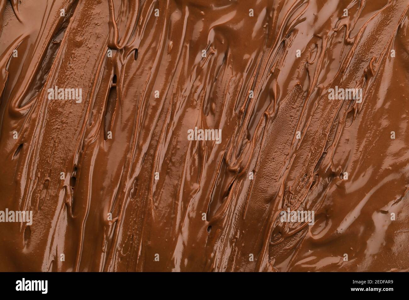 Sweet melted chocolate as background Stock Photo - Alamy