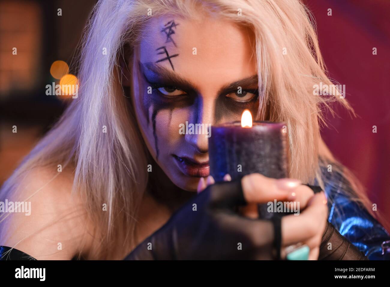 Witch performing black magic ritual Stock Photo - Alamy